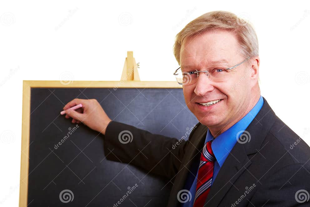 Teacher Writing on Chalkboard Stock Photo - Image of lecturer, manager ...