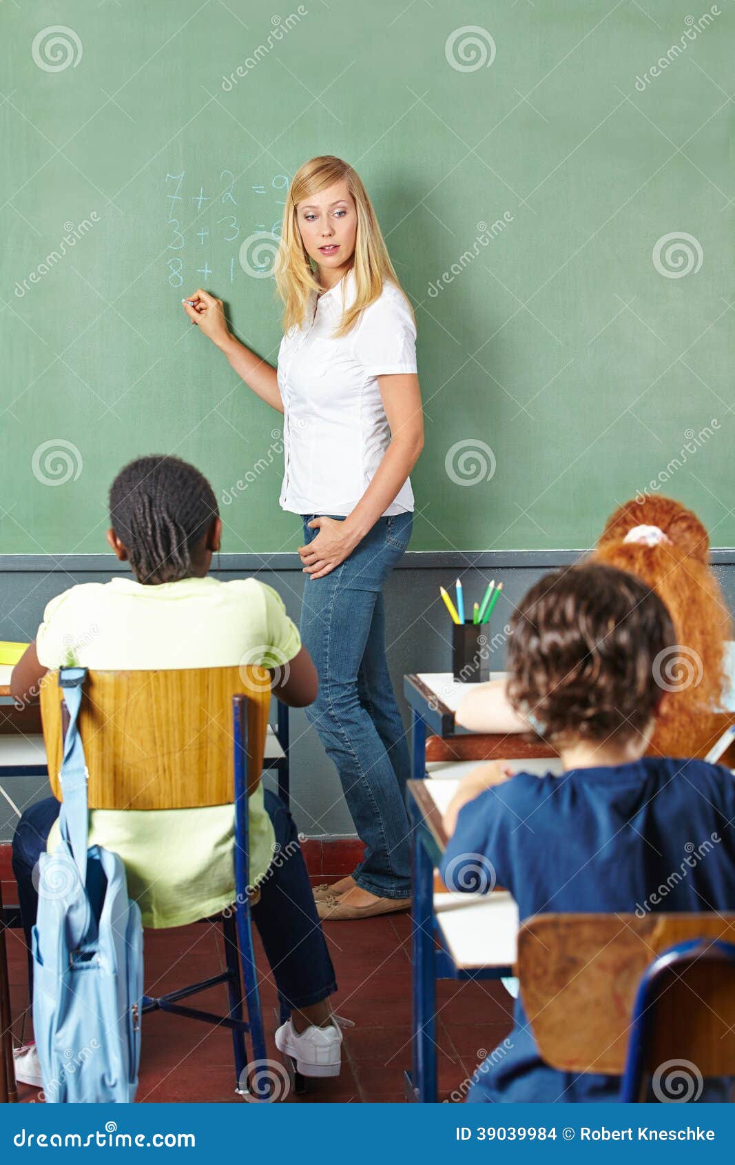 Teacher Writing on Chalkboard Stock Photo - Image of math, primary ...