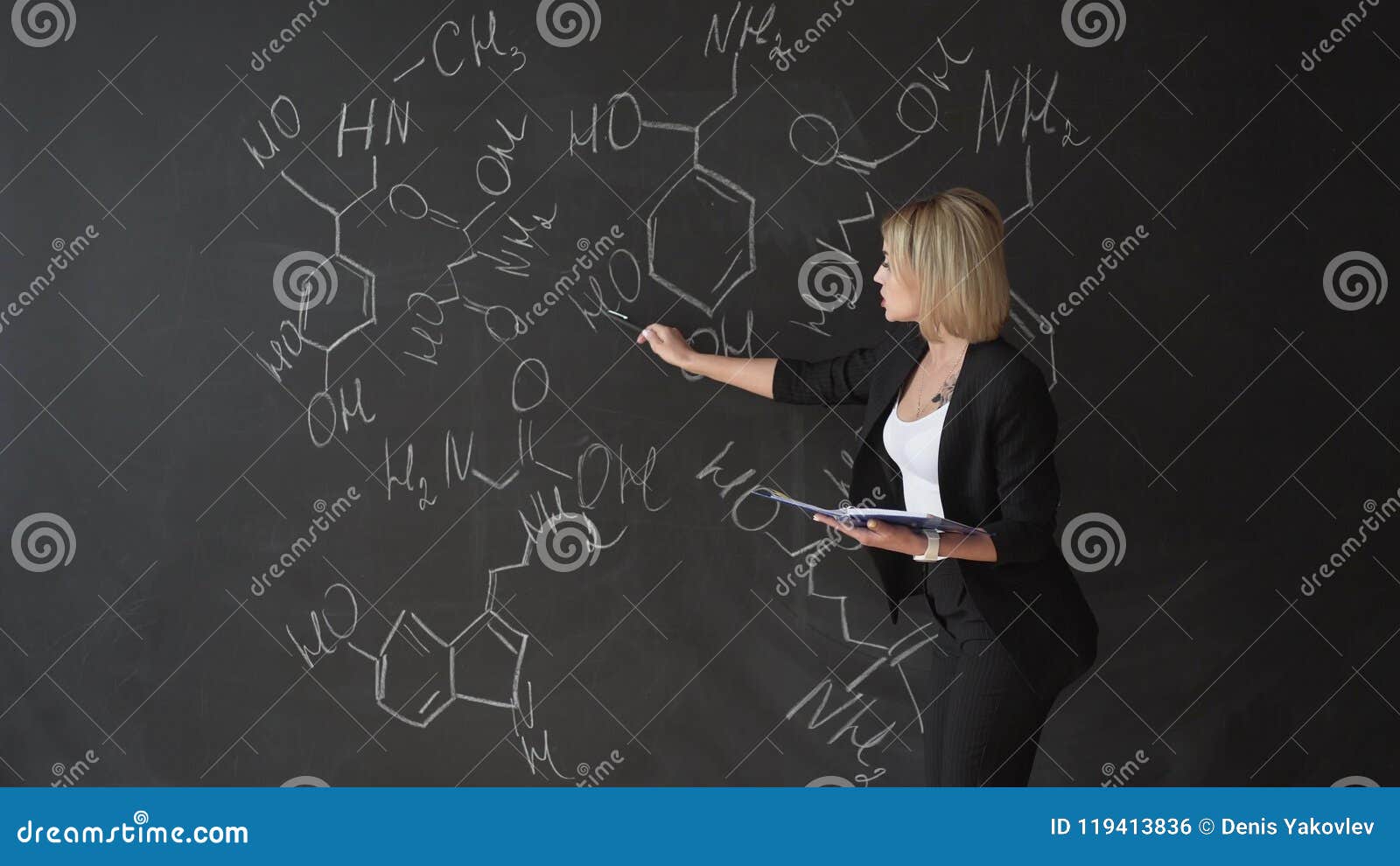 Teacher Writing Formulas on the Chalk Board and Explains the Students ...