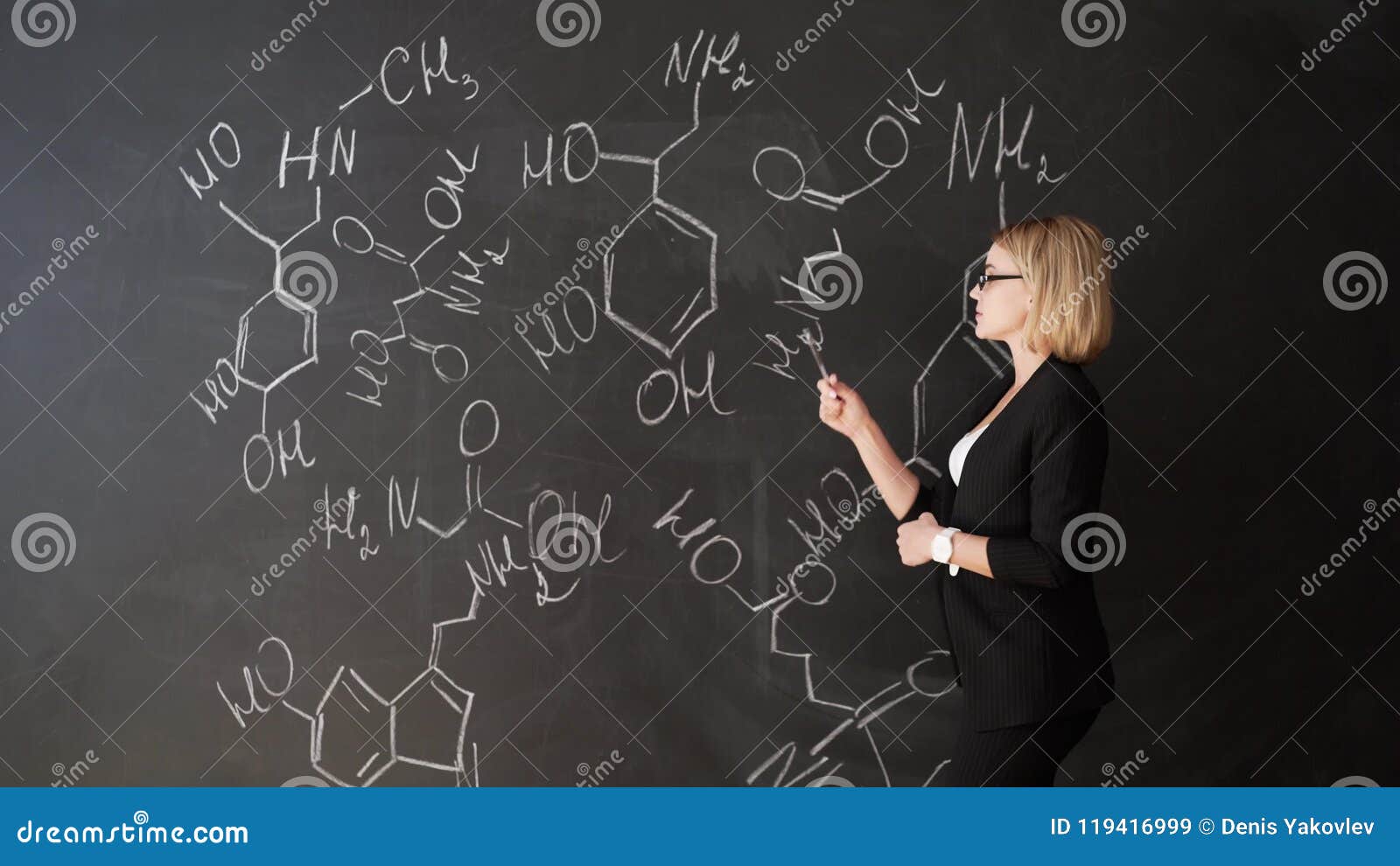 Teacher Writing Formulas on the Chalk Board and Explains the Students ...