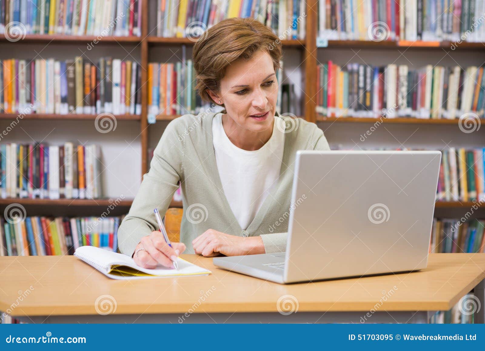 Teacher Writing on Notepad at Library Stock Image - Image of notepad ...