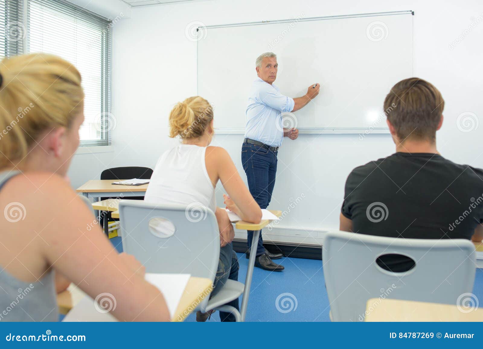 Teacher Writing on White Board in Front Class Stock Image - Image of ...
