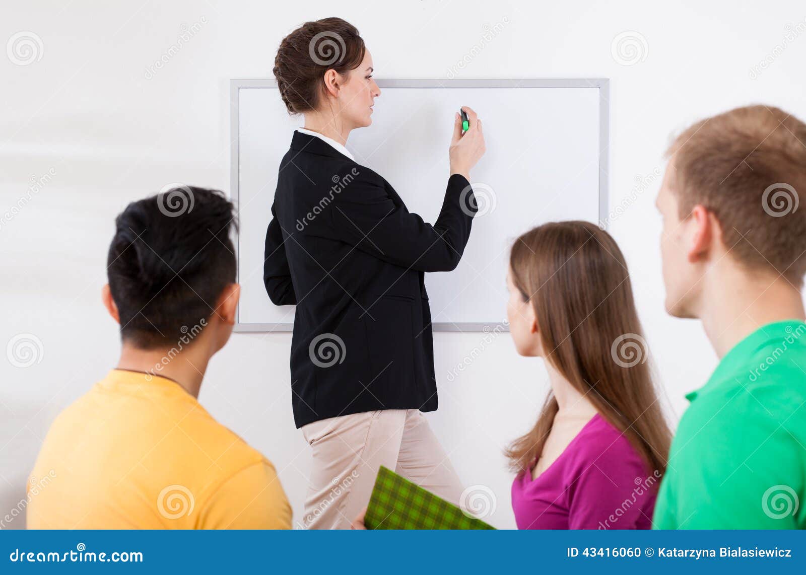 Teacher Writing on Whiteboard at Classroom Stock Photo - Image of ...