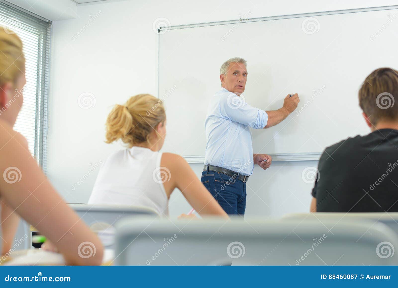 Teacher Writing on Whiteboard in Front Class Stock Image - Image of ...