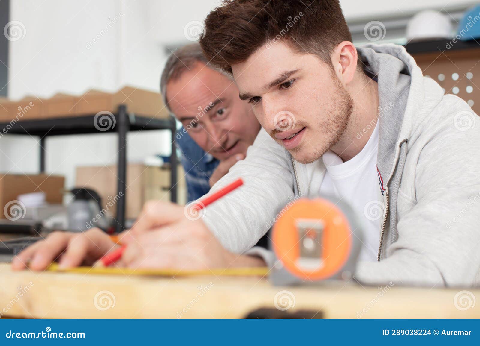 Teacher and Young Man Writing with Pencil Stock Photo - Image of ...