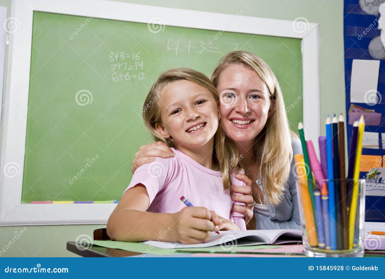 Teacher and Young Student in Class Writing Stock Photo - Image of green ...