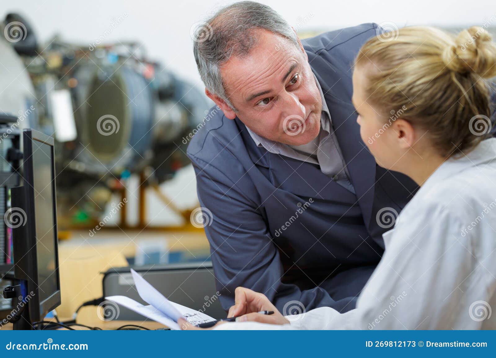 Teacher and Young Woman Working in Workshop Stock Image - Image of ...