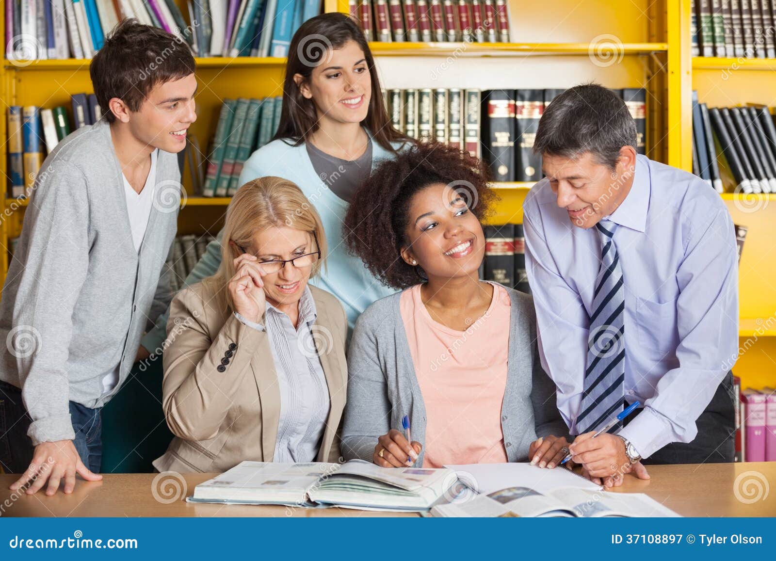 Teachers Discussing with Students in Library Stock Image - Image of ...