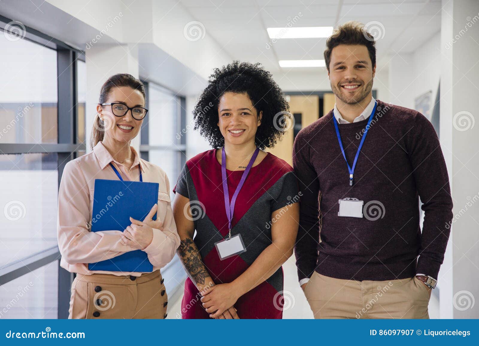 Teachers in the Hallway stock image. Image of males, interior - 86097907