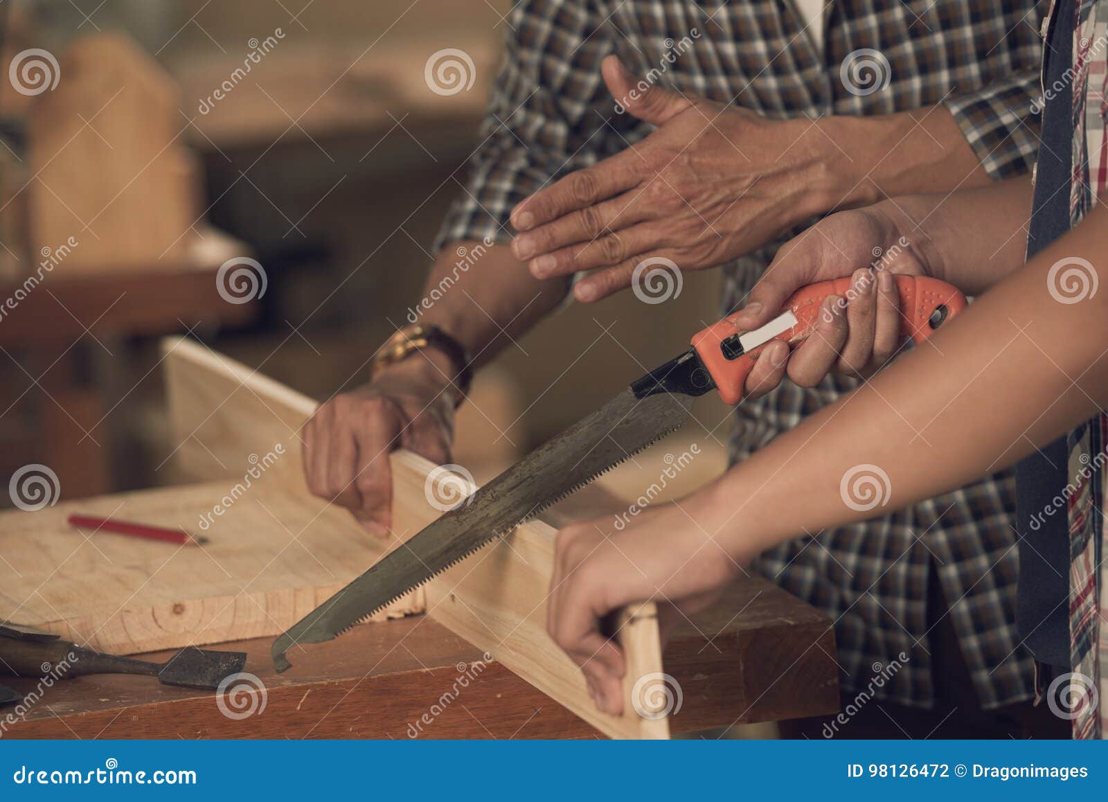 Teaching apprentice stock photo. Image of sawing, child - 98126472