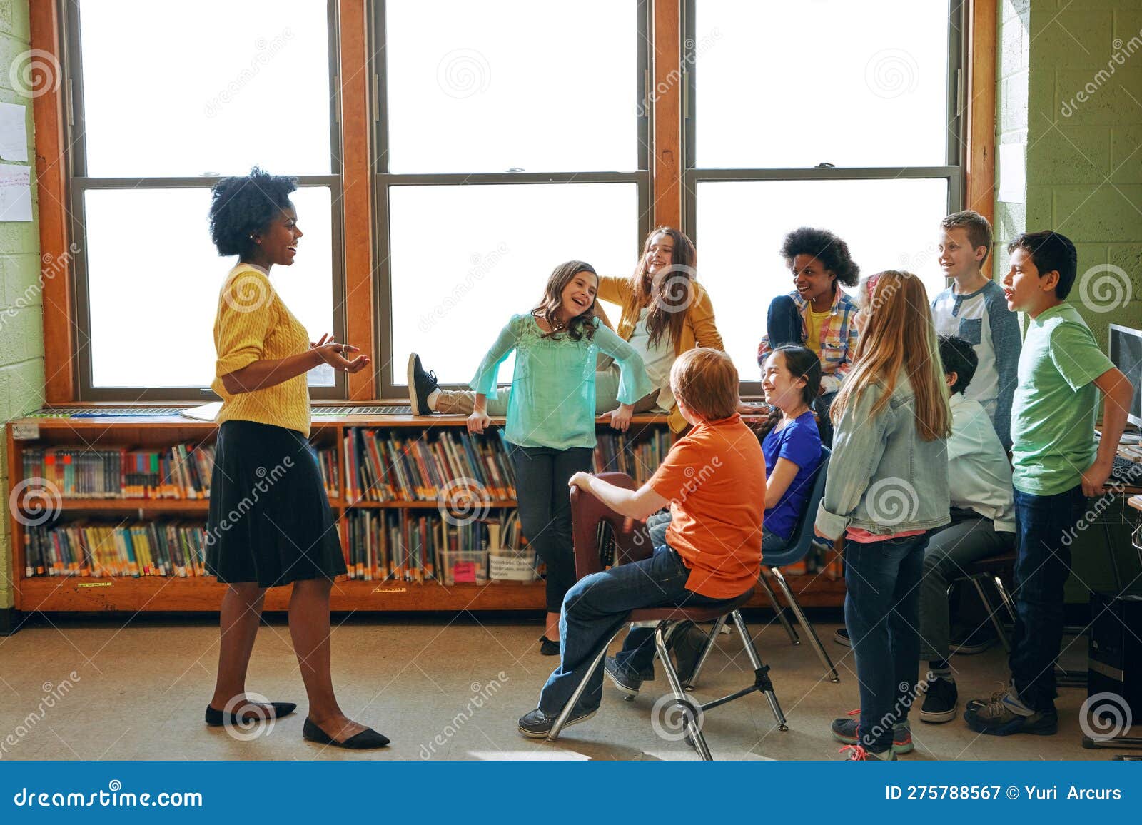 Teaching is Her Calling. a Young Teacher Educating a Group of ...