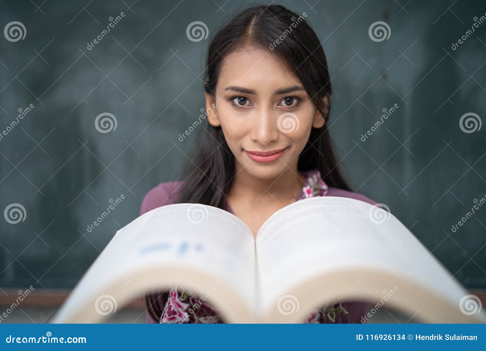 Teaching holding a book stock photo. Image of friendly - 116926134