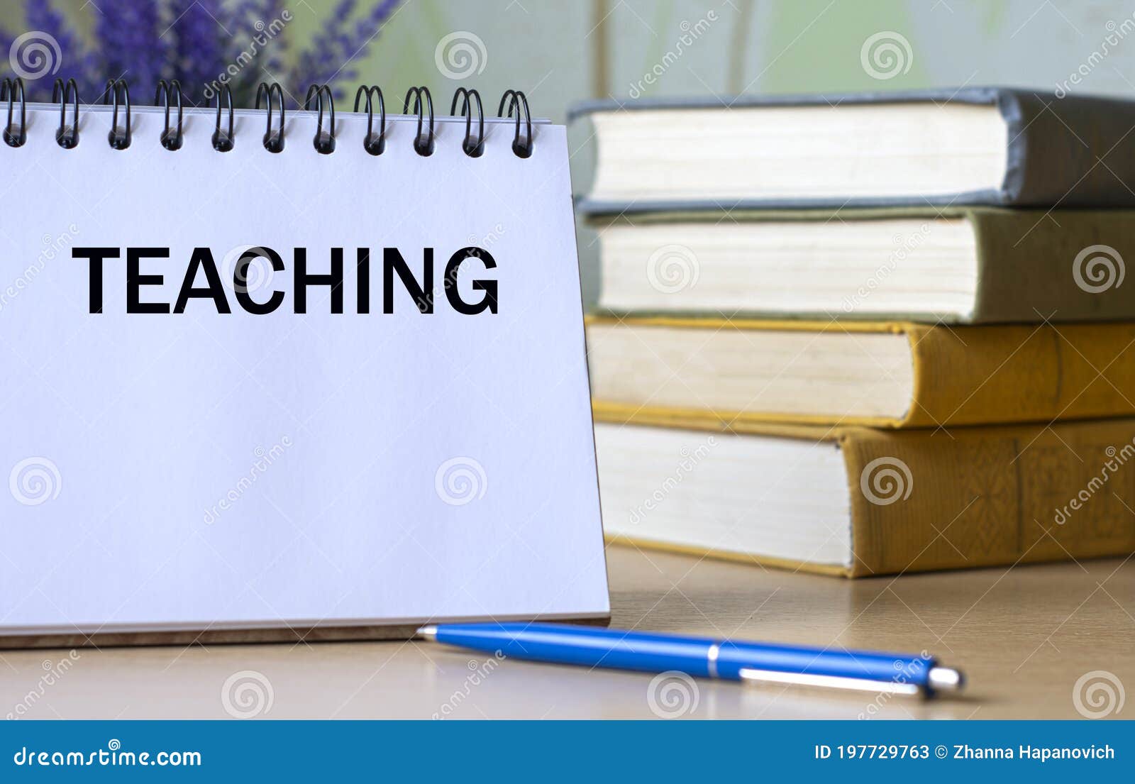 TEACHING - a Word in a Notebook Against the Background of Old Books ...