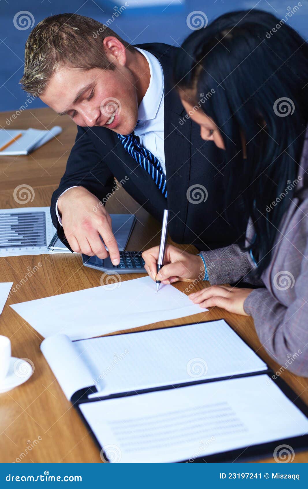 Team of 2 Business People Working on Documents Stock Image - Image of ...
