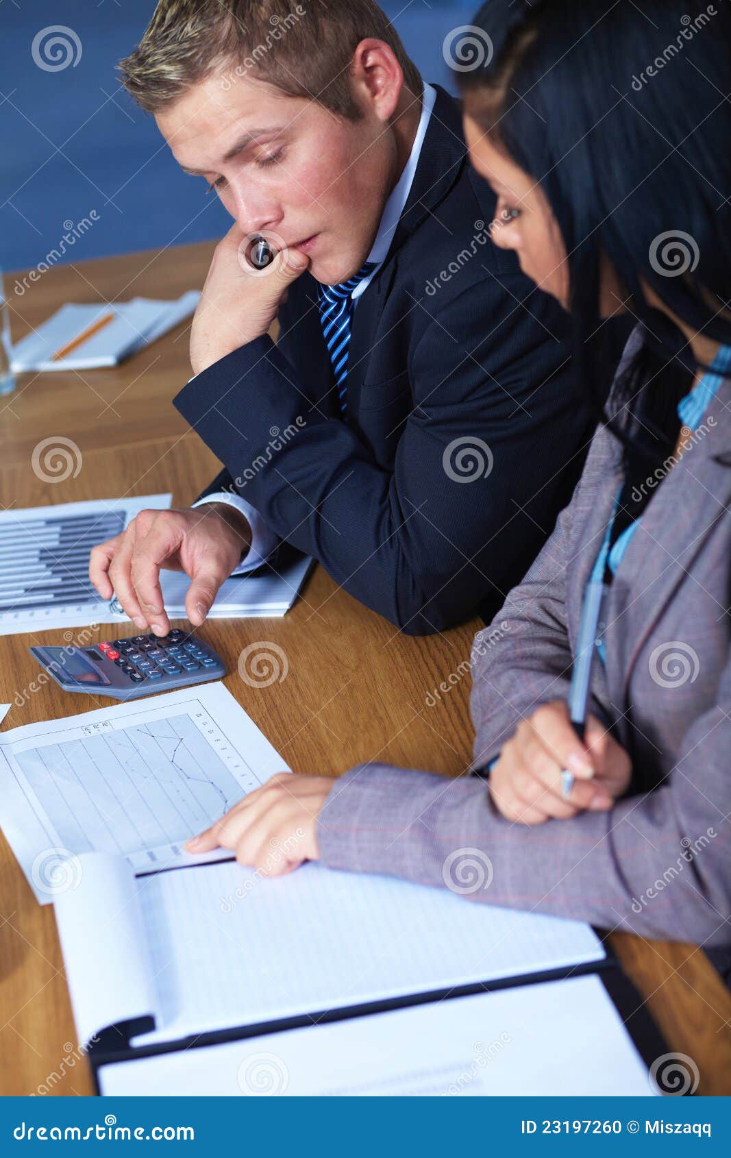 Team of 2 Business People Working on Documents Stock Photo - Image of ...