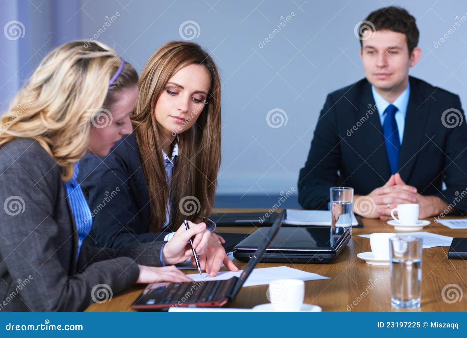 Team of 3 Business People Sitting at Table Stock Image - Image of ...