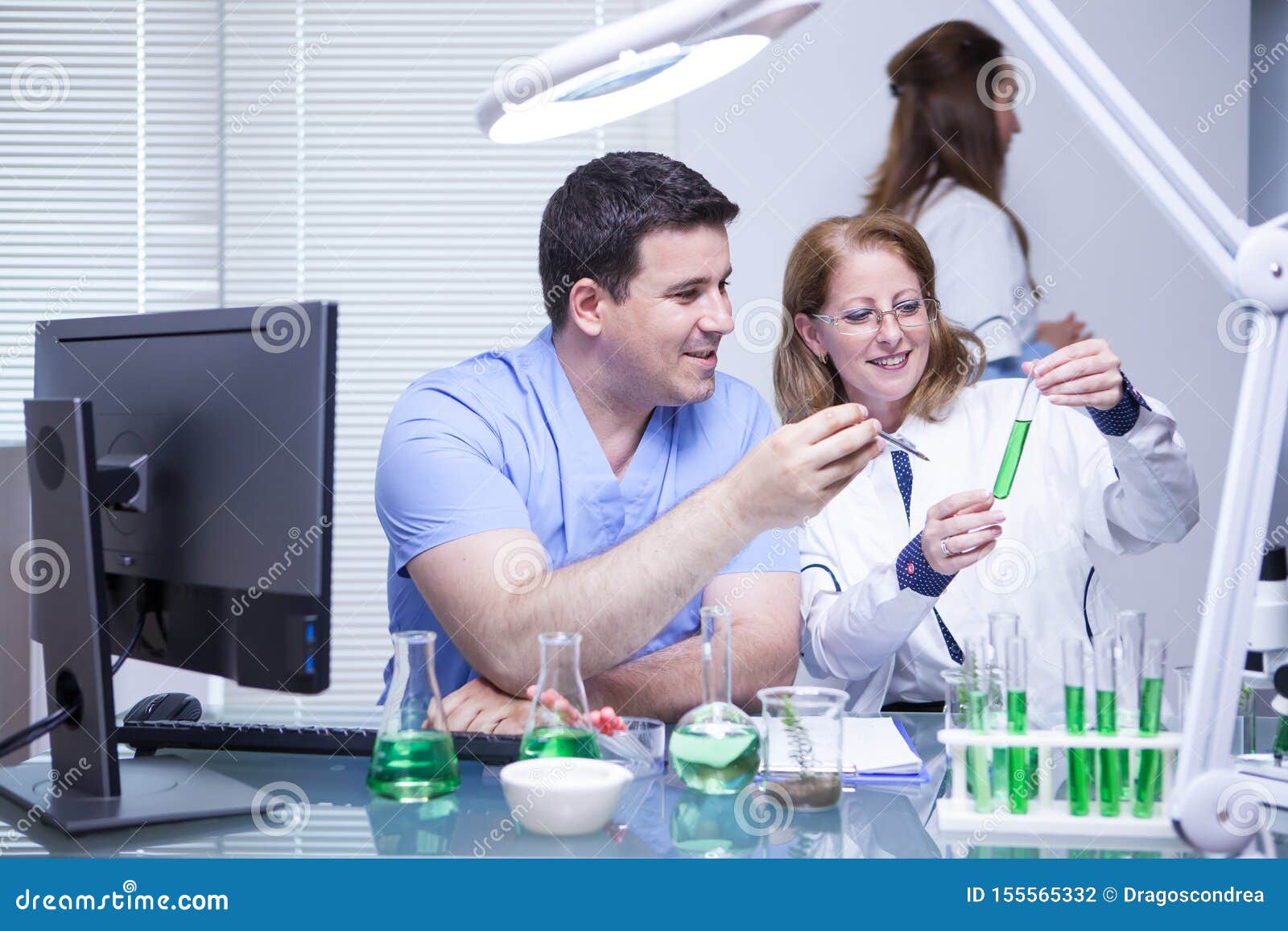 Team of Advanced Scientist Checking the Solution from a Test Tube in ...