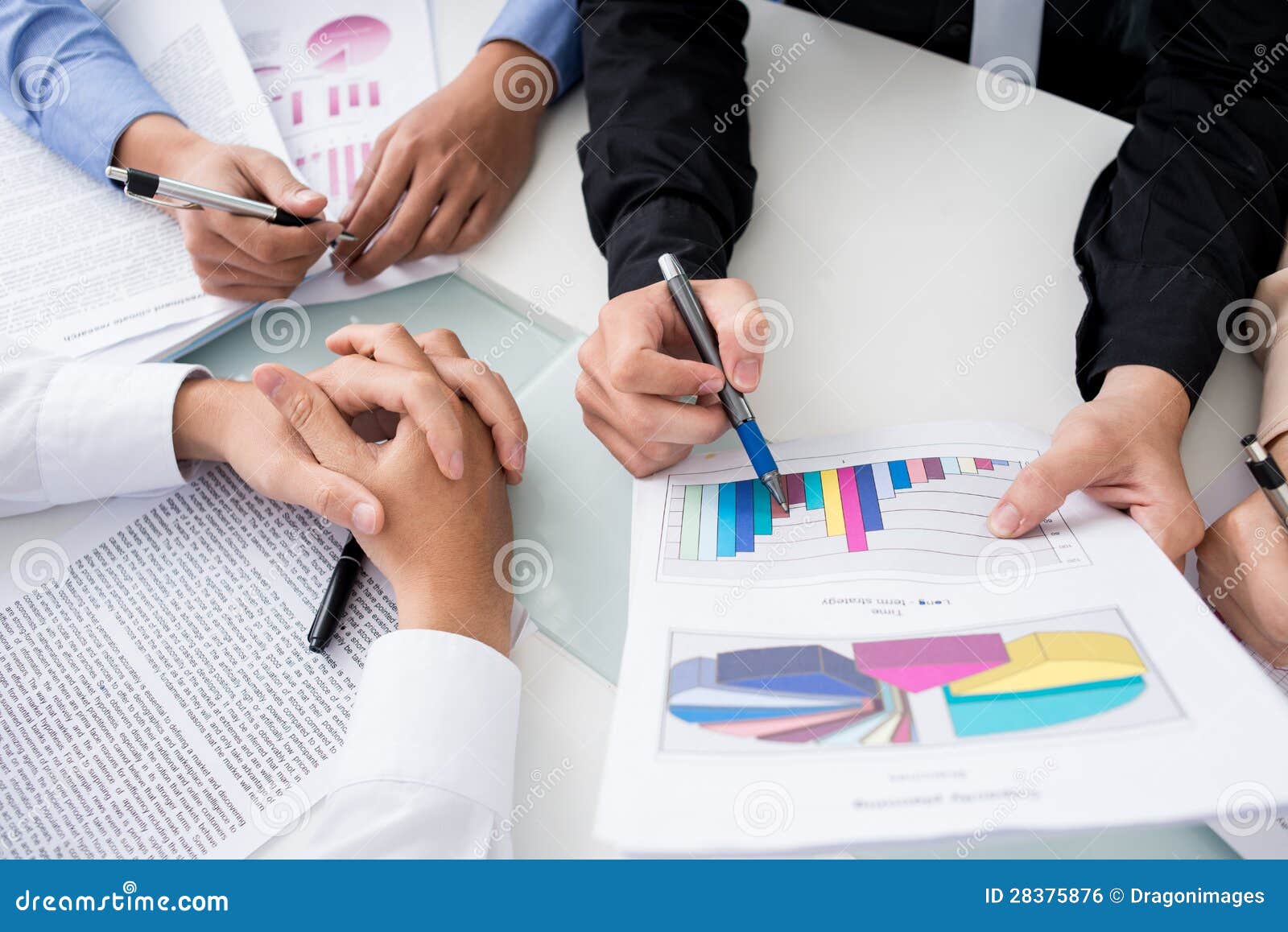 Team of analysts stock photo. Image of graphs, discussing - 28375876