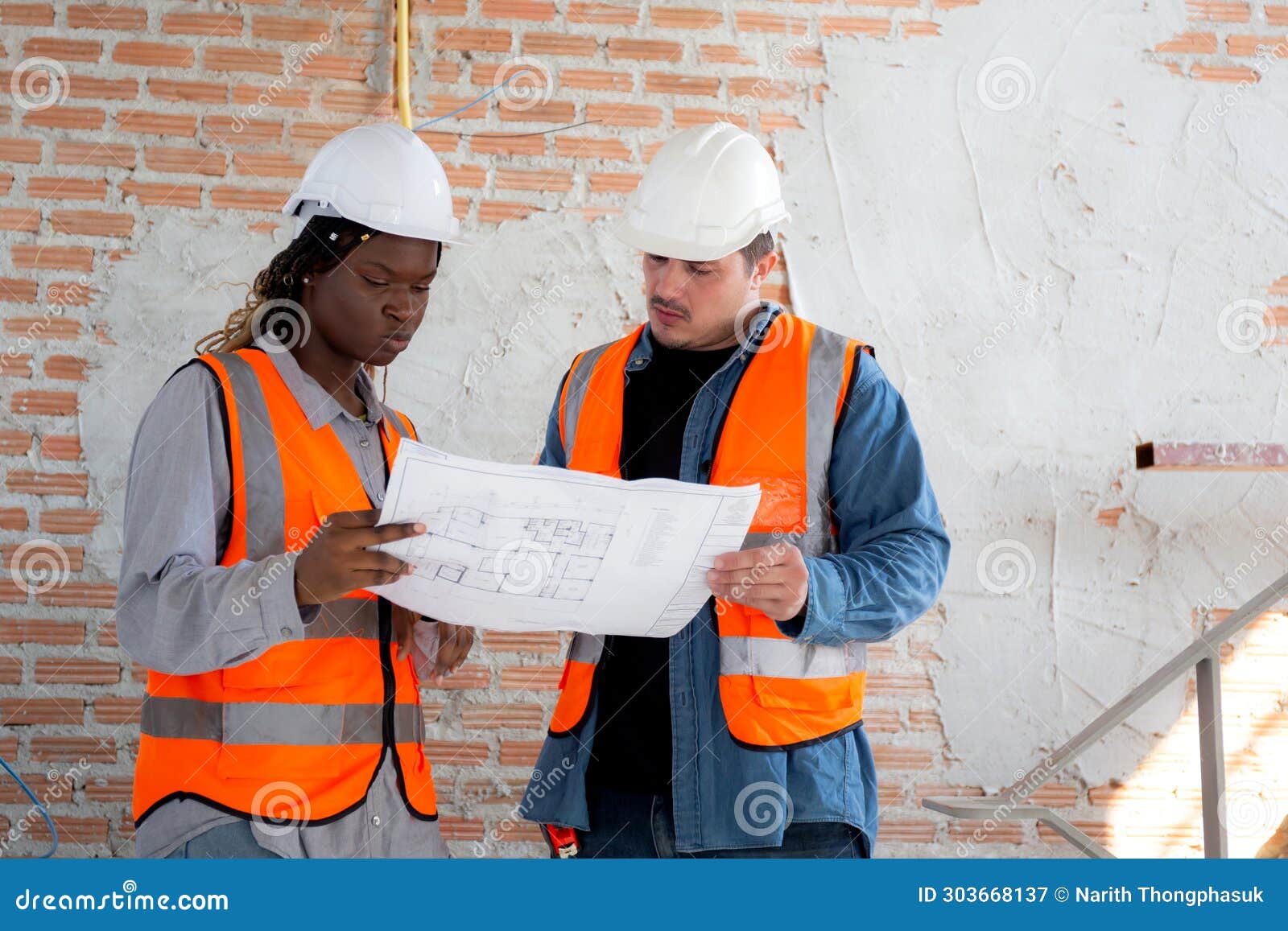 Team of Architect or Engineer Wearing Hardhat Looking Blueprint for ...
