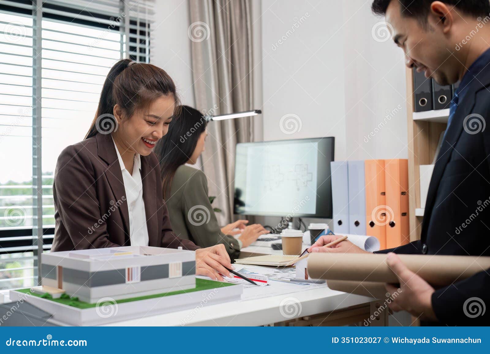 Team of Architects Collaborating on Modern House Design in Office ...