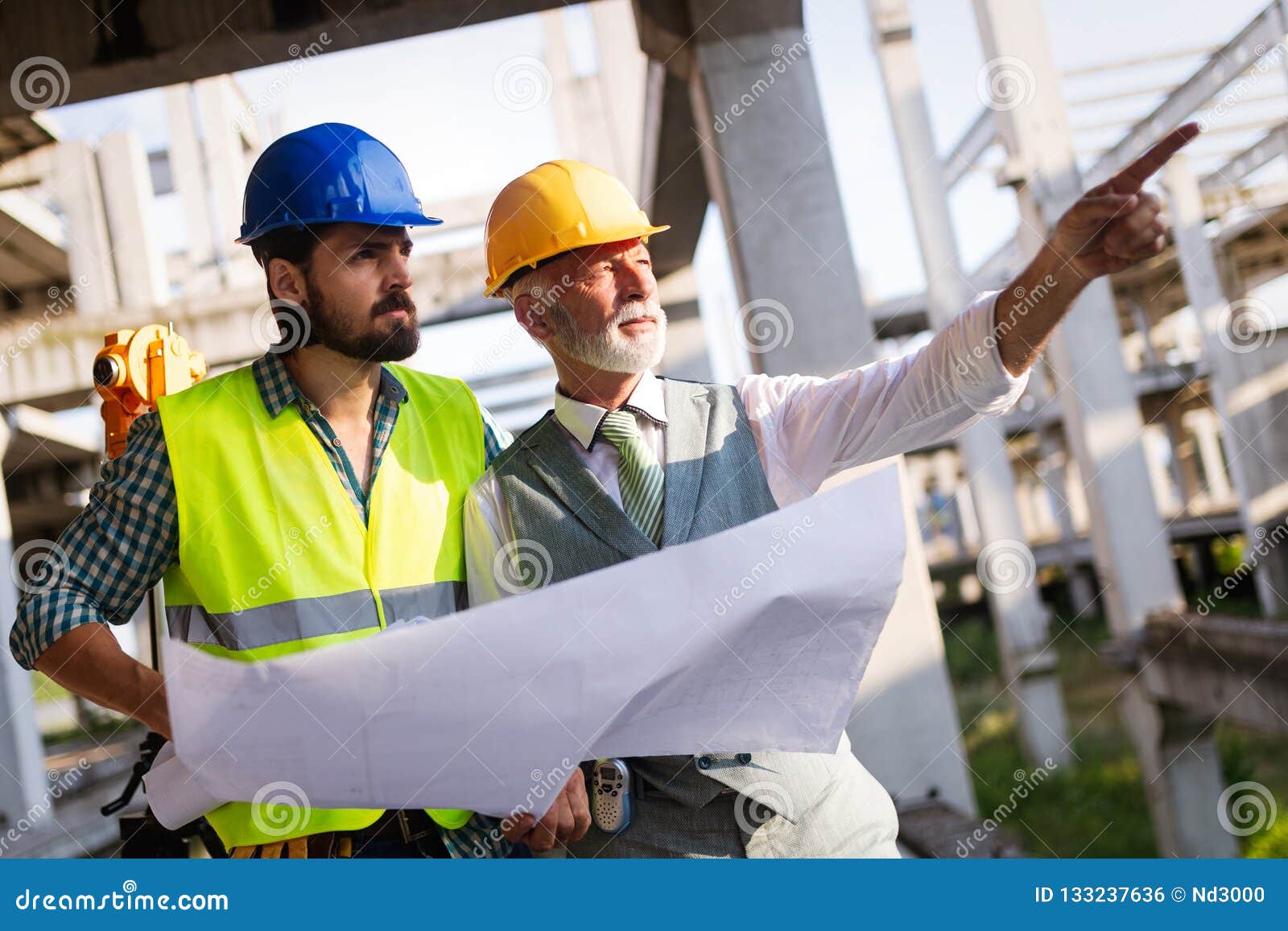 Team of Architects and Engineer in Group on Construciton Site Check ...