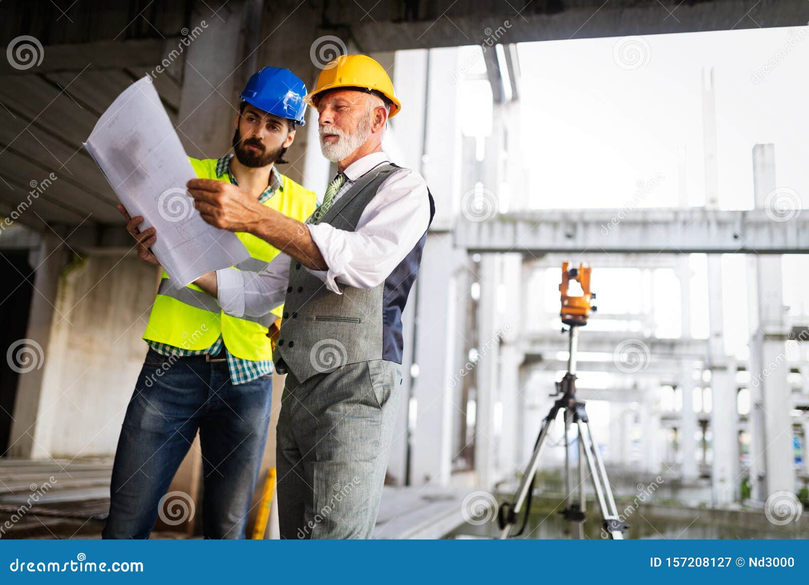 Team of Architects and Engineer in Group on Construciton Site Check ...