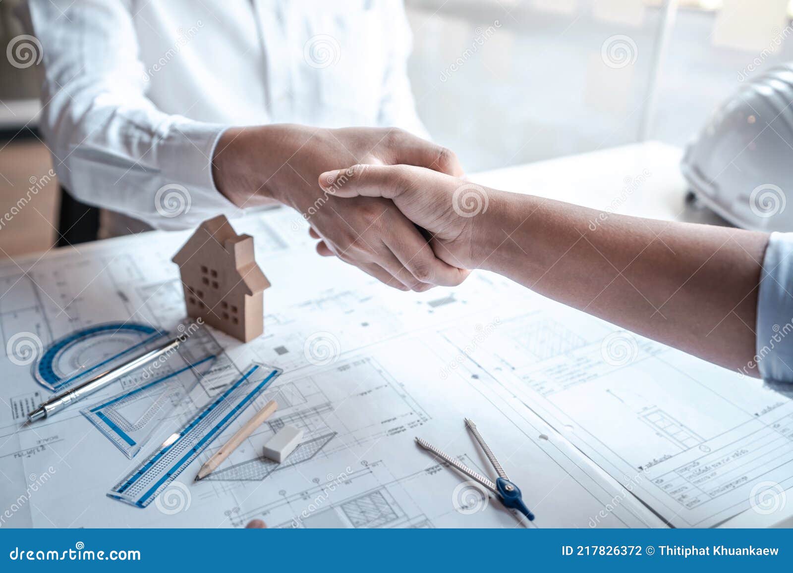 Team of Architects or Engineering Shaking Hands while Working ...
