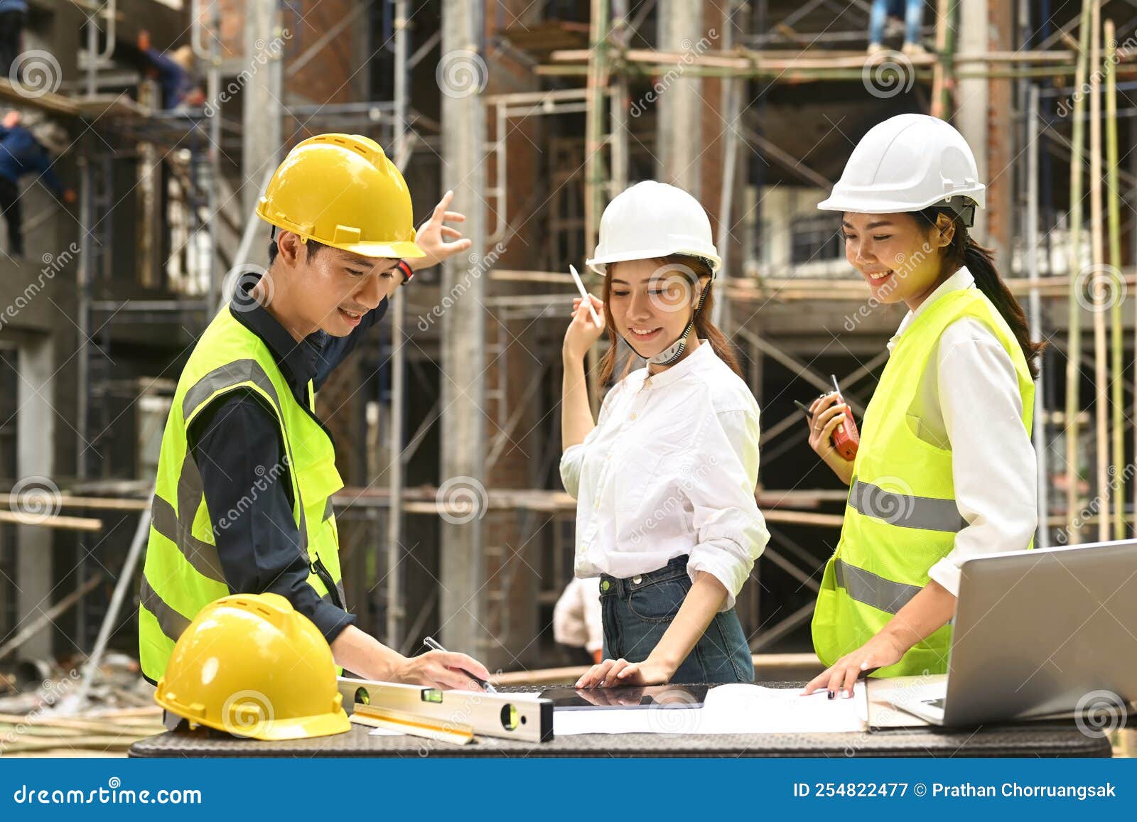 Team of Architects and Executive Supervisor Discussing Project Details ...