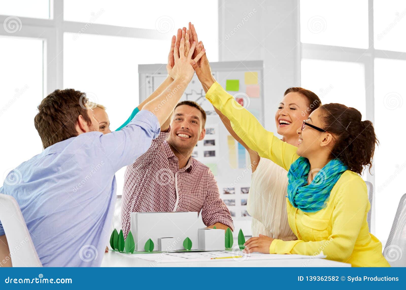 Team of Architects Making High Five at Office Stock Photo - Image of ...