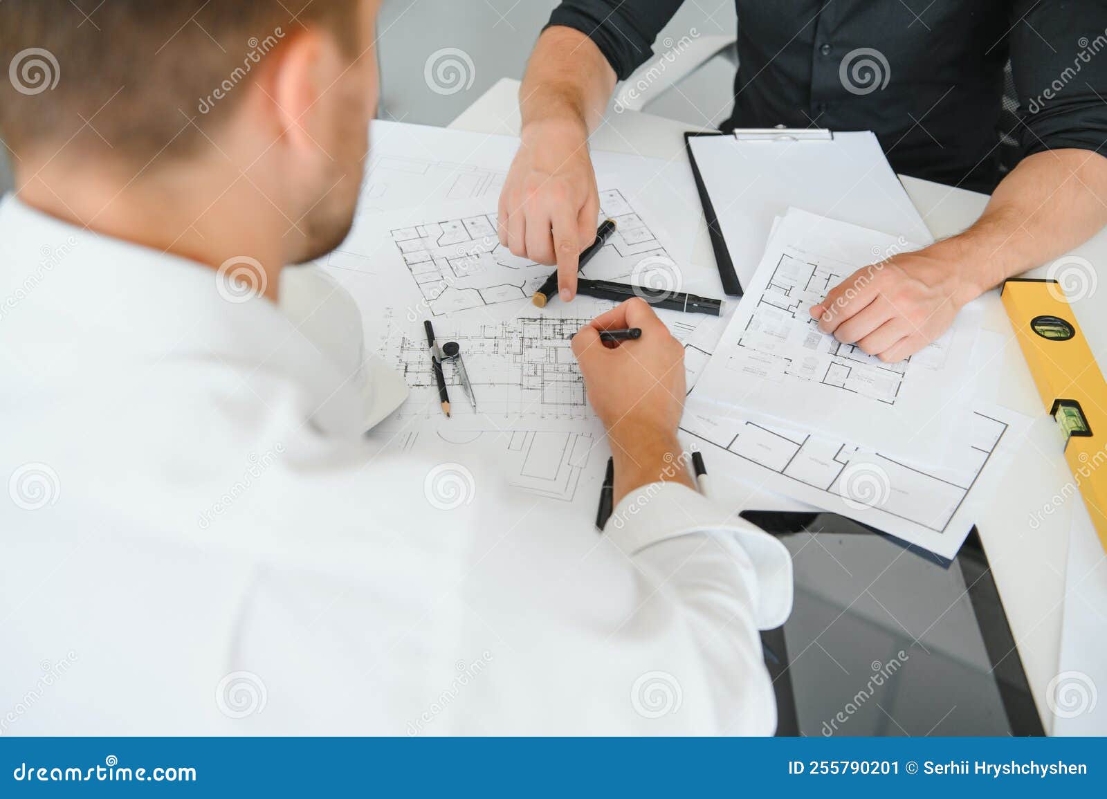 Team of Architects People in Group on Construciton Site Check Documents ...