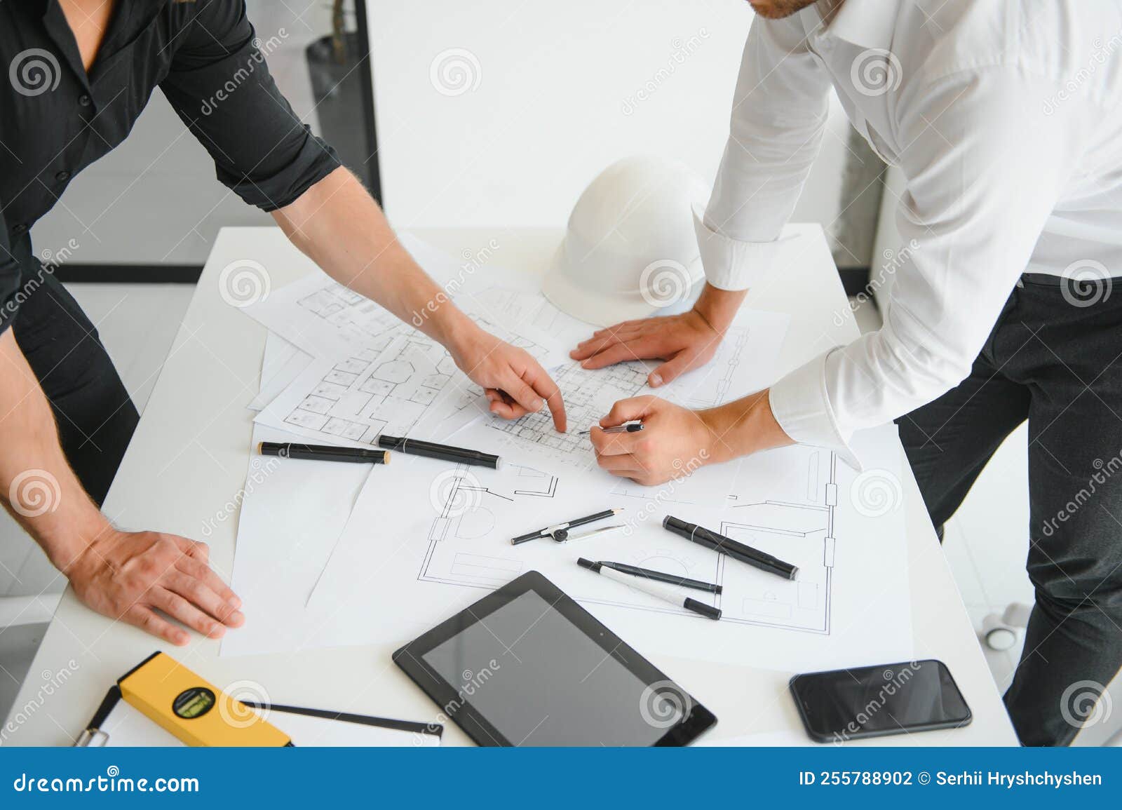Team of Architects People in Group on Construciton Site Check Documents ...