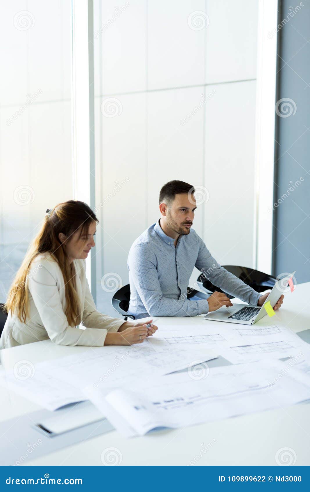 Team of Architects Working on Construction Plans Stock Photo - Image of ...