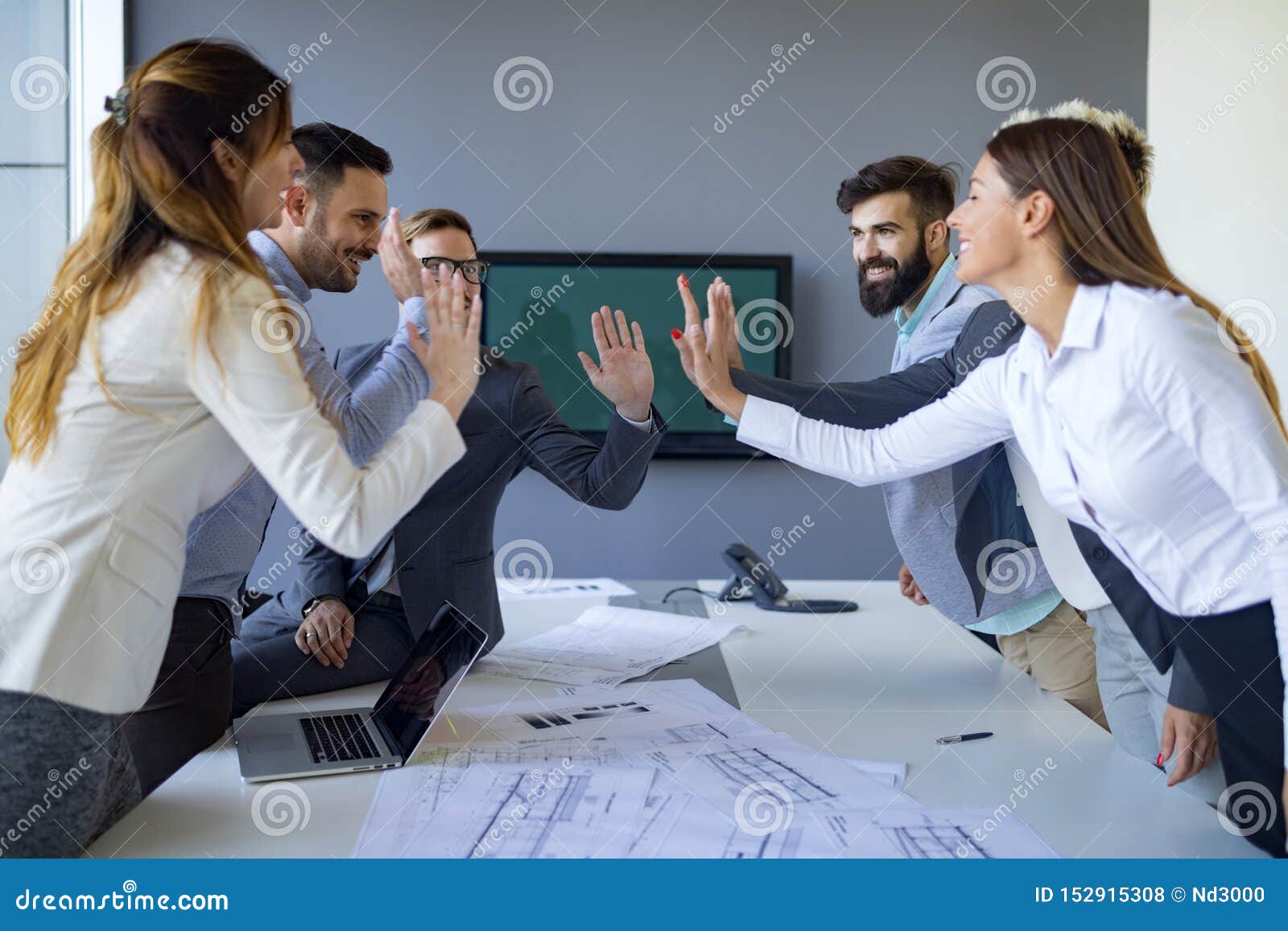 Team of Architects Working on Construction Plans Stock Photo - Image of ...