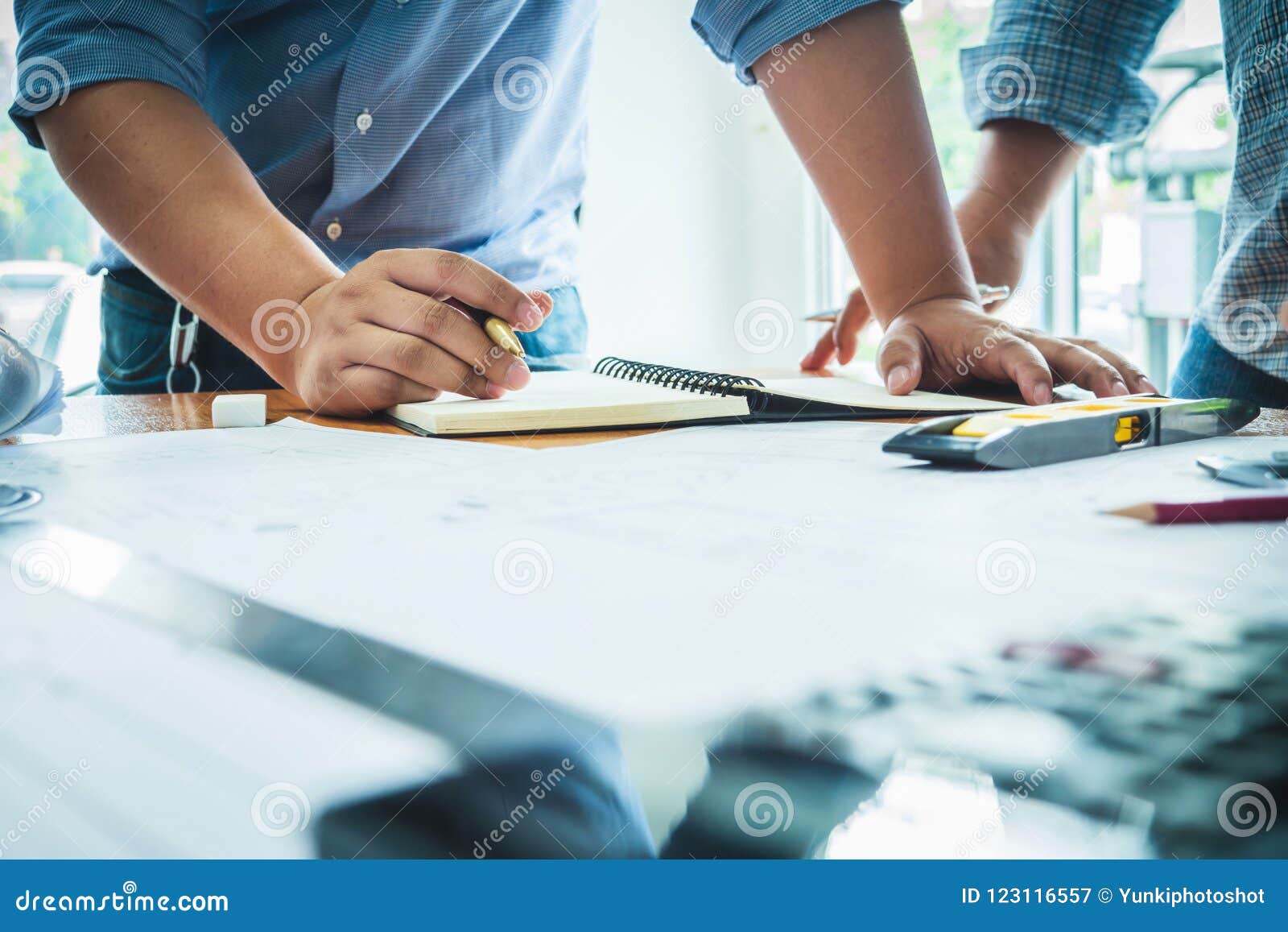 Team of Architecture Engineer Construction with Paper Plan Project ...