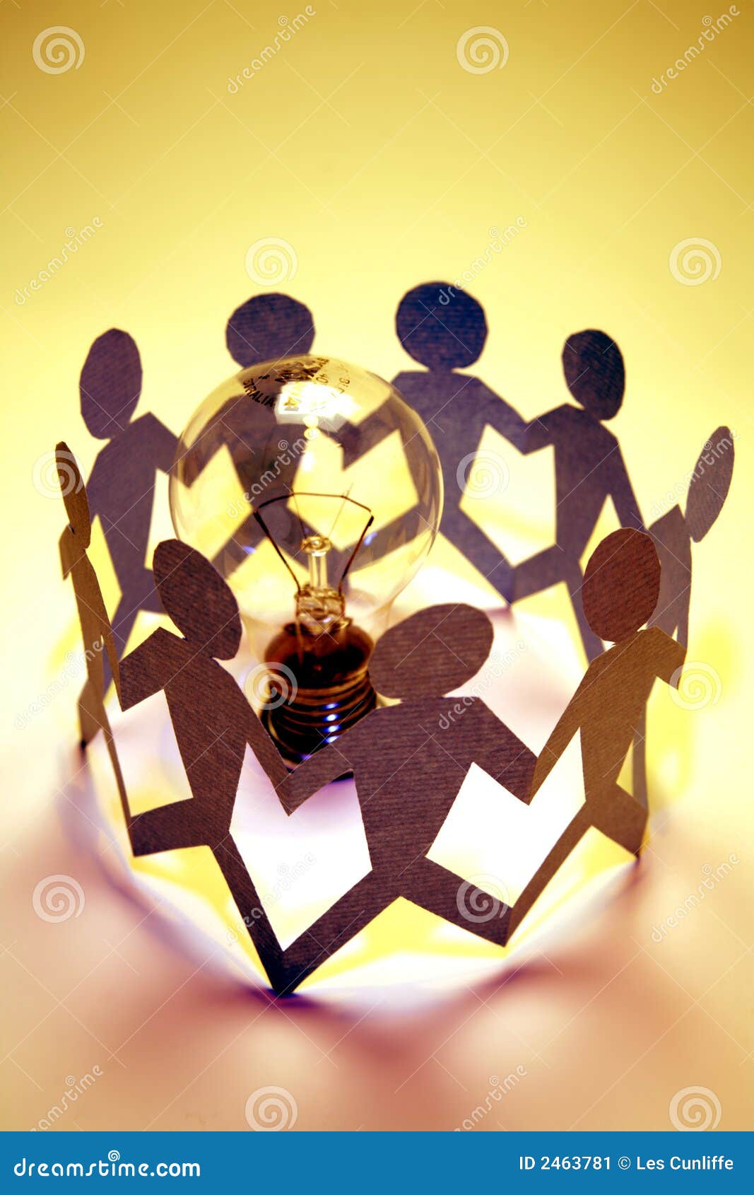 Team around lightbulb stock image. Image of invention - 2463781