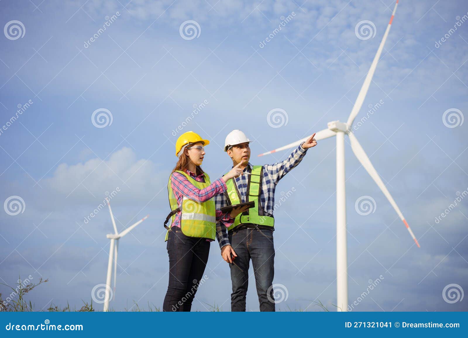 Team of Asian Engineers Discussing and Progress Check Wind Turbine ...