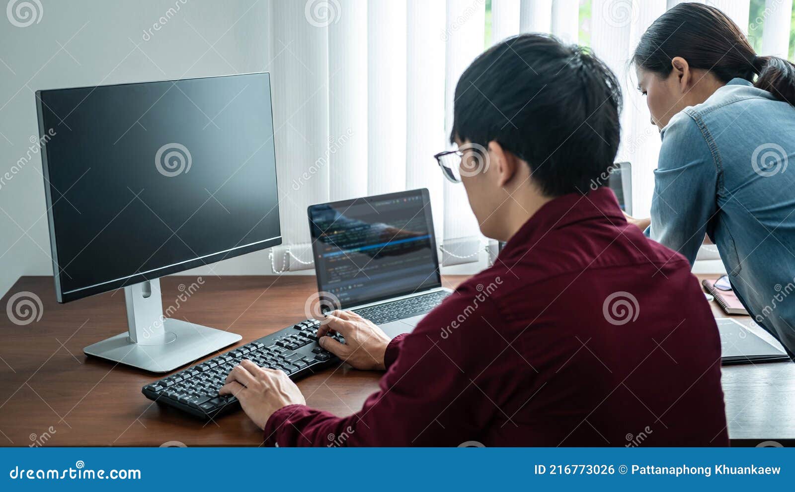 Asian Programmer Woman Pointing And Looking On Multiple Laptop Screen ... Asian Programmer Woman Pointing And Looking On Multiple Laptop Screen ...