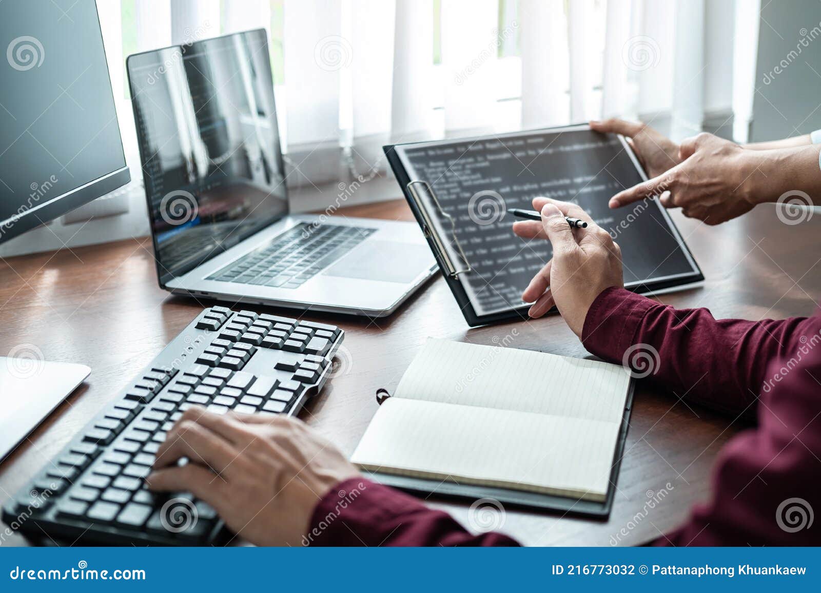Asian Programmer Seen Typing Code For A User Interface Design On Dual Monitors Royalty-Free ...