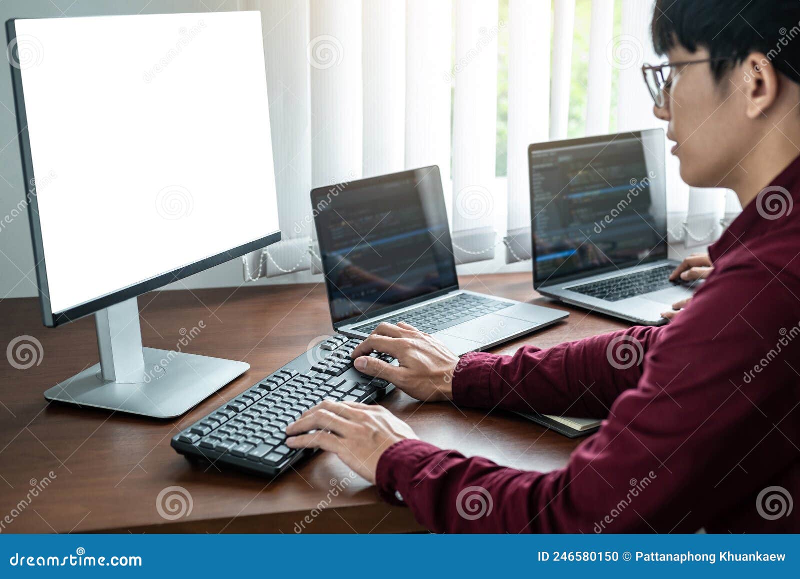 Asian Programmer Woman Pointing And Looking On Multiple Laptop Screen ... Asian Programmer Woman Pointing And Looking On Multiple Laptop Screen ...