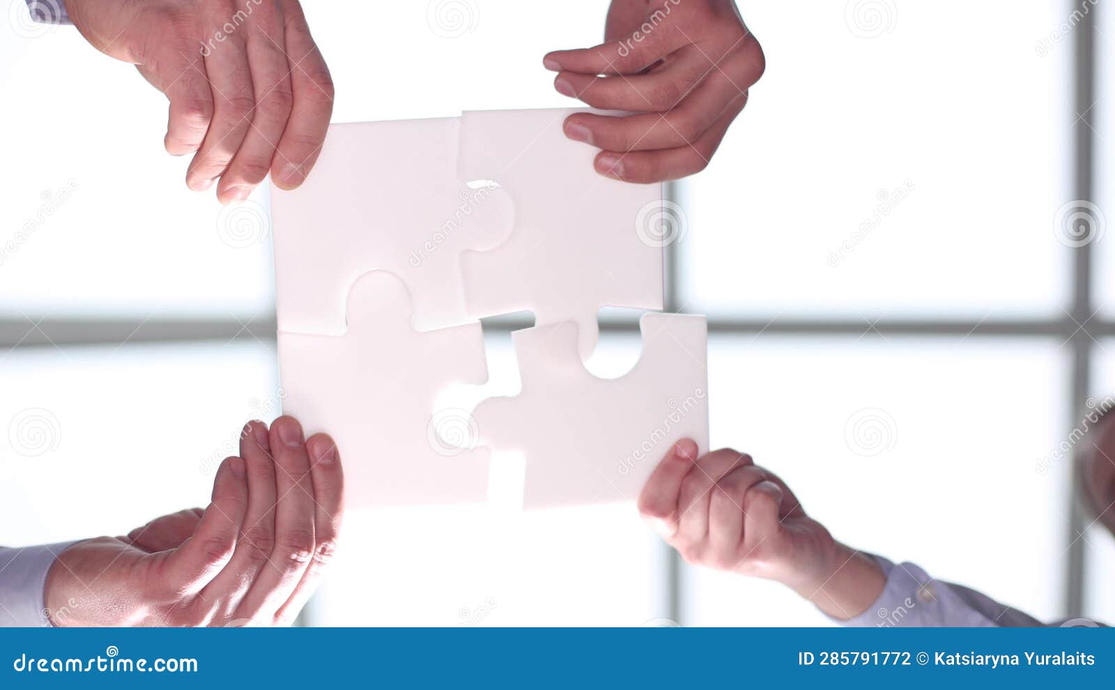 The Team Assembles the Puzzle while Standing in the Office, View from ...