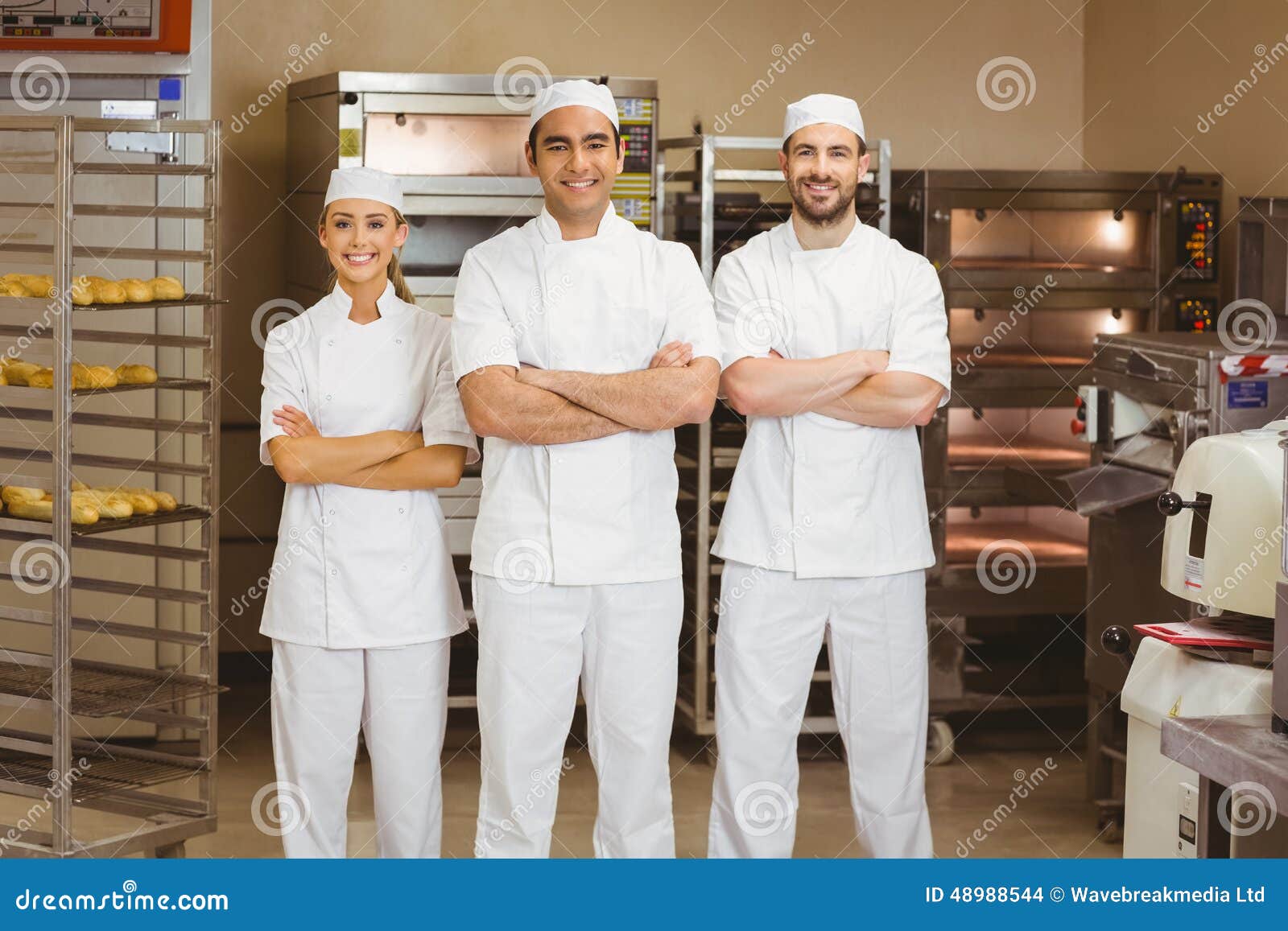 Team of Bakers Smiling at Camera Stock Photo - Image of people, looking ...