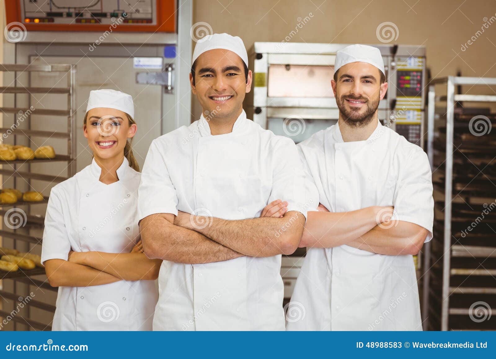Team of Bakers Smiling at Camera Stock Image - Image of front, people ...