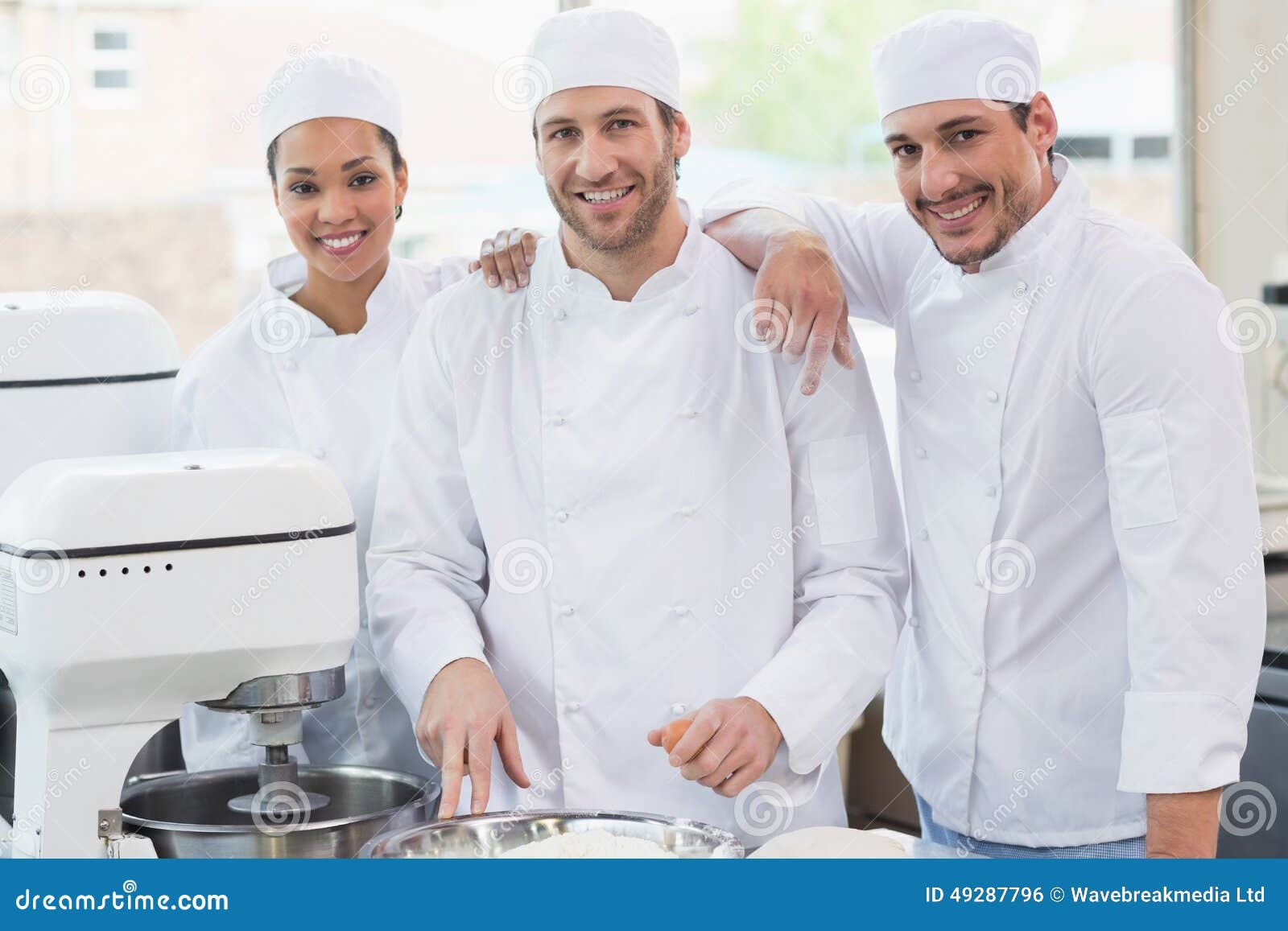 Team of Bakers Smiling at Camera Stock Photo - Image of bakery ...