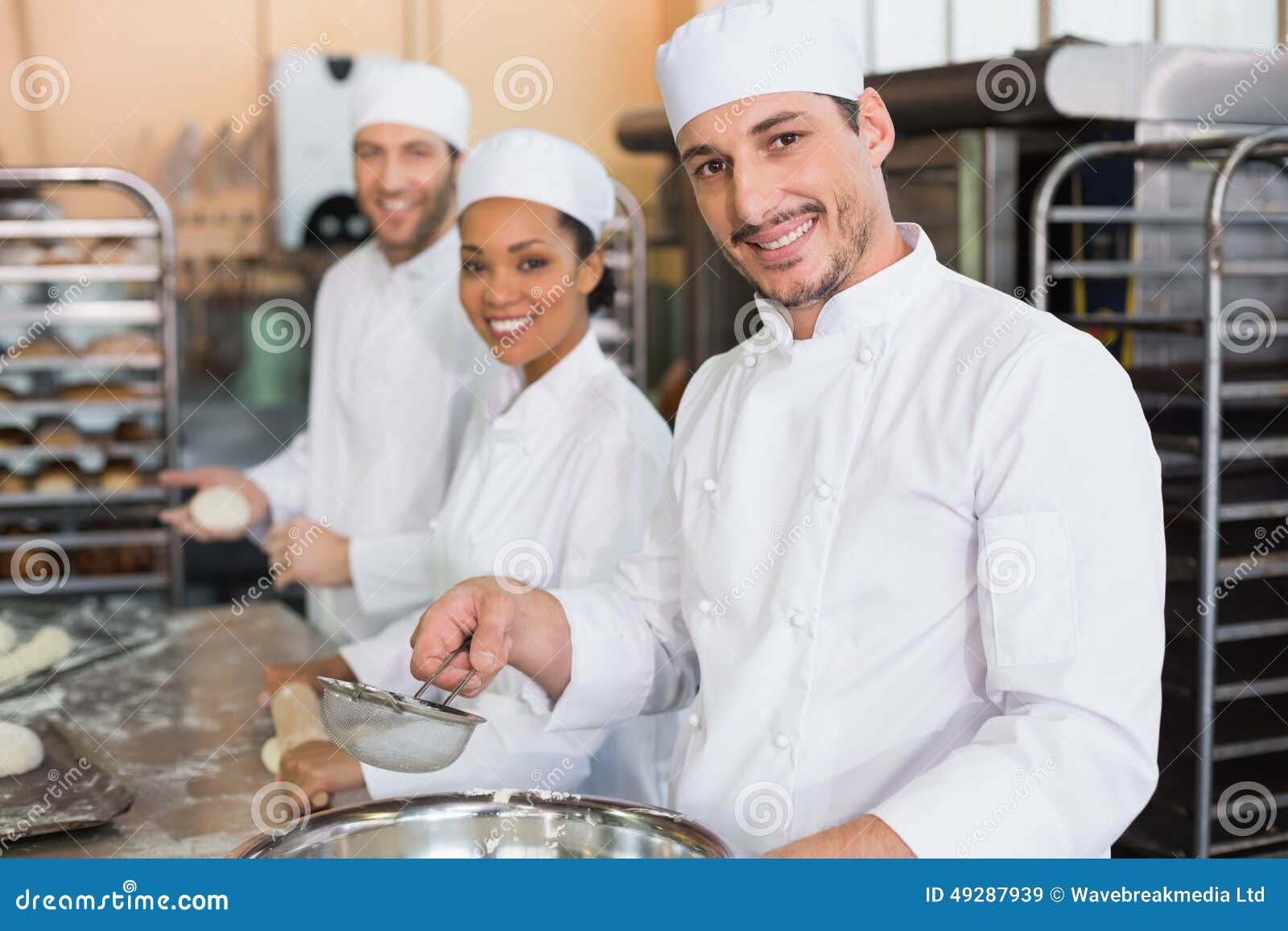 Team of Bakers Smiling at Camera Stock Image - Image of adult, industry ...