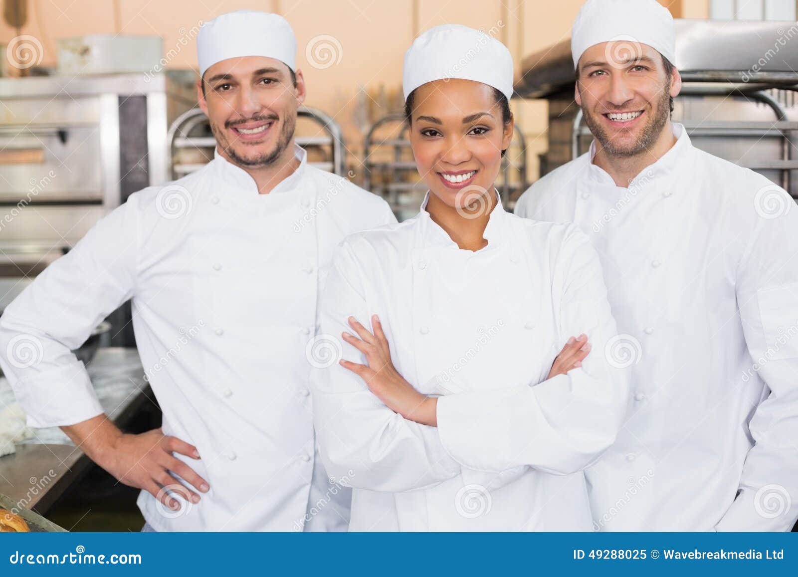Team of Bakers Smiling at Camera Stock Image - Image of folded ...