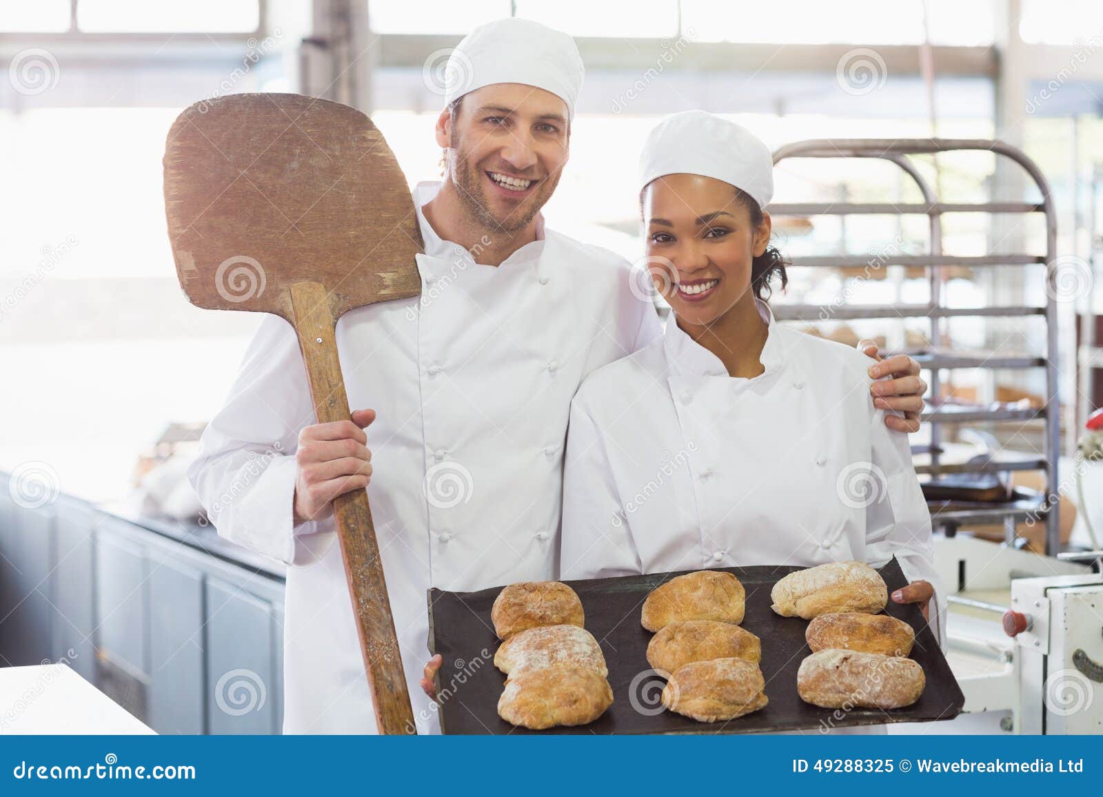 Team of Bakers Smiling at Camera with Trays of Loaves Stock Image ...