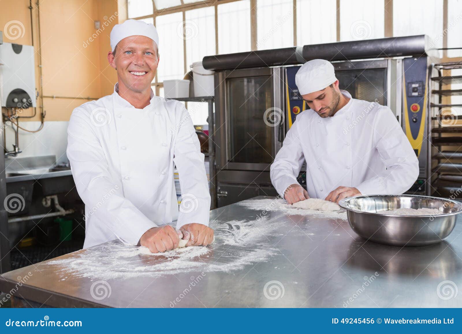 Team of Bakers Working Together Stock Photo - Image of kneading ...
