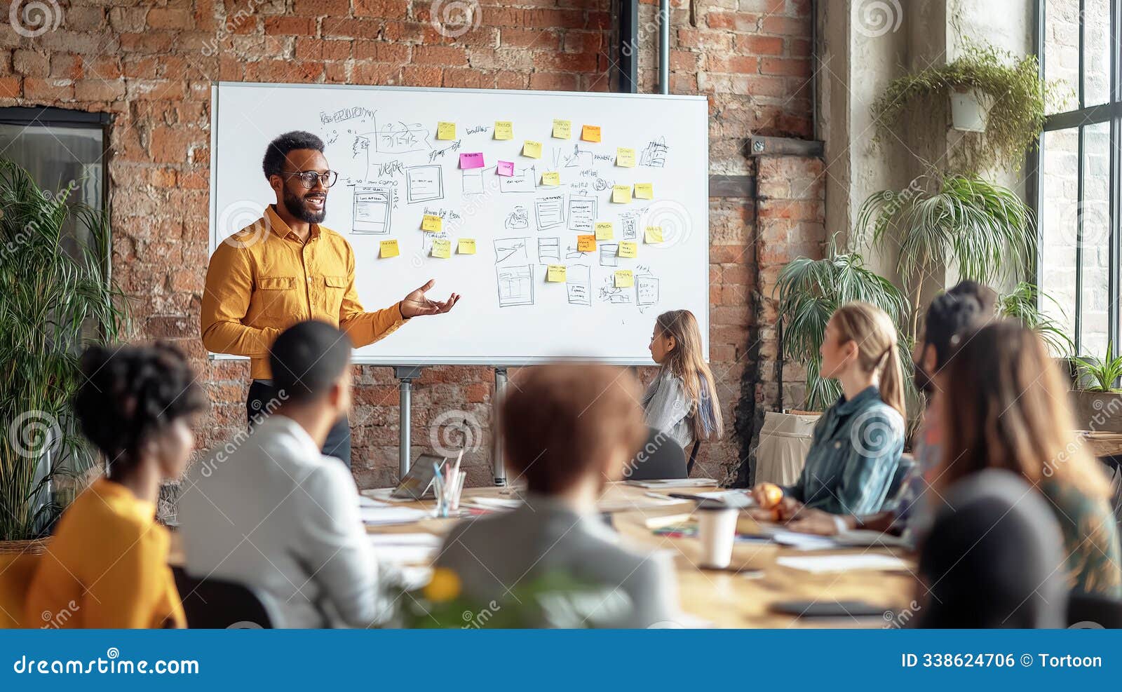Team Brainstorming Session with a Presenter Explaining Ideas on a ...