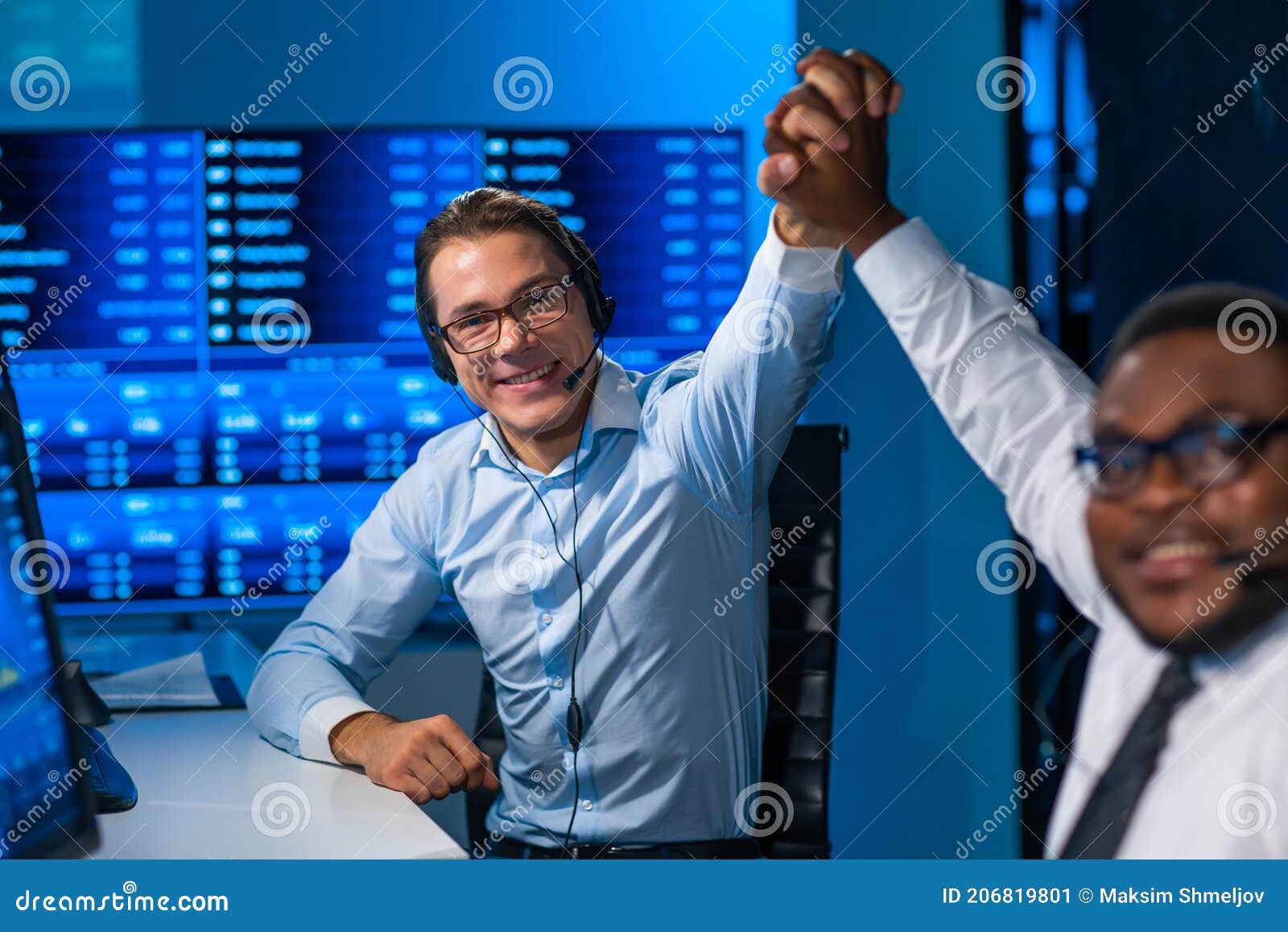 Team of Brokers is Working in Office Using Workstation and Analysis ...