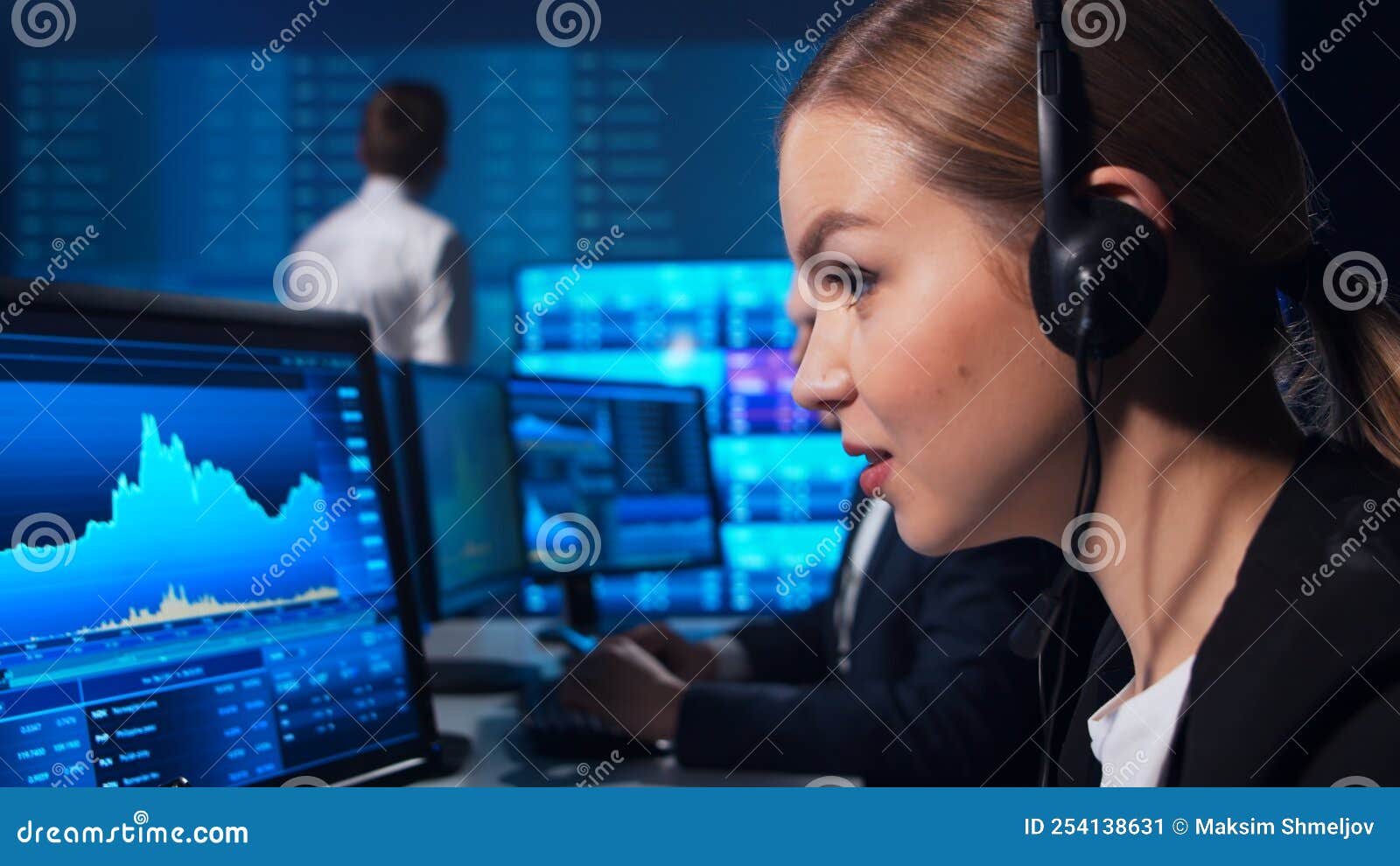 Team of Brokers is Working in Office Using Workstation and Analysis ...